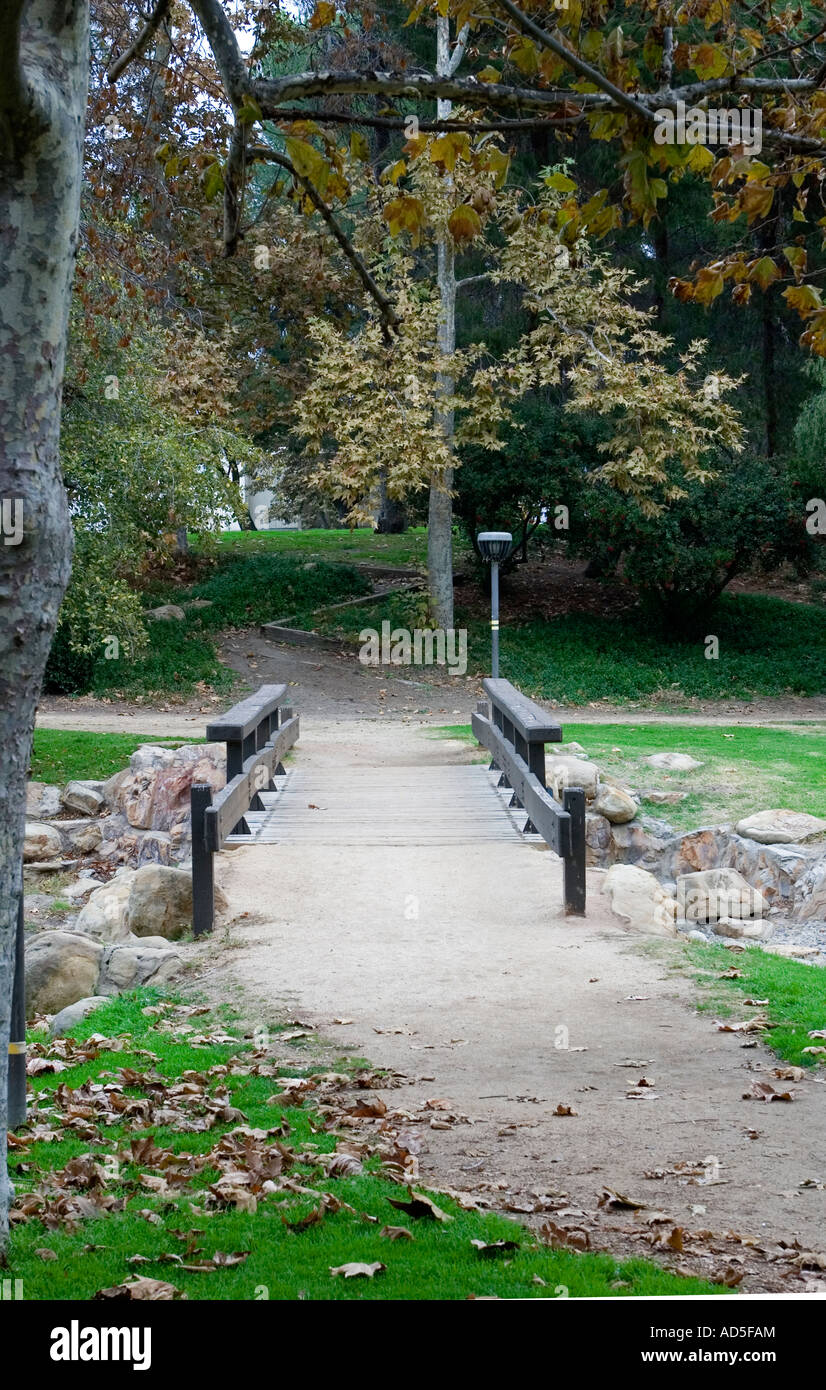 Park Path Over Wooden Bridge Stock Photo - Alamy