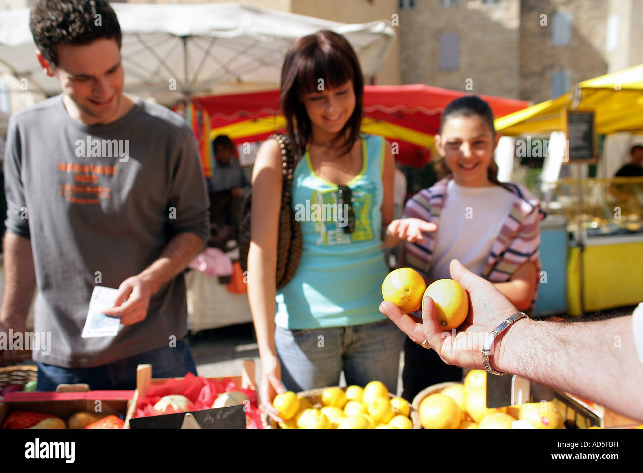 Family at the fruit market Stock Photo - Alamy