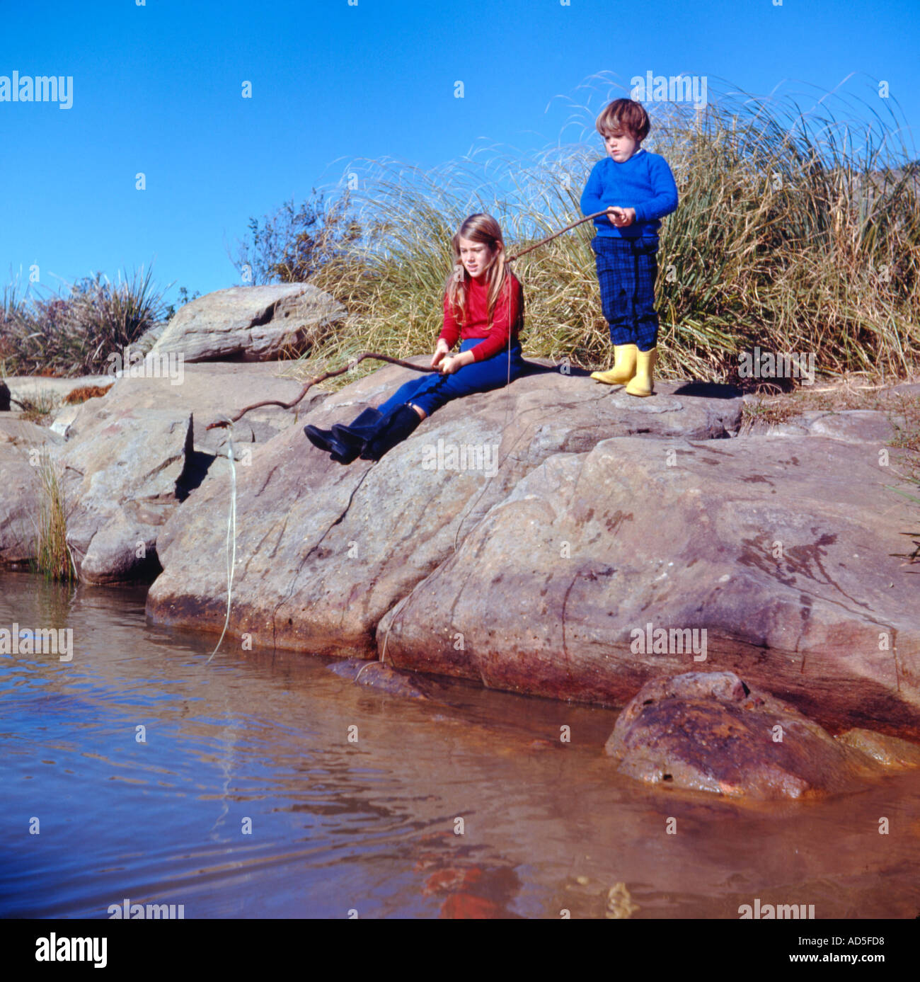 Girl and boy fishing hi-res stock photography and images - Alamy