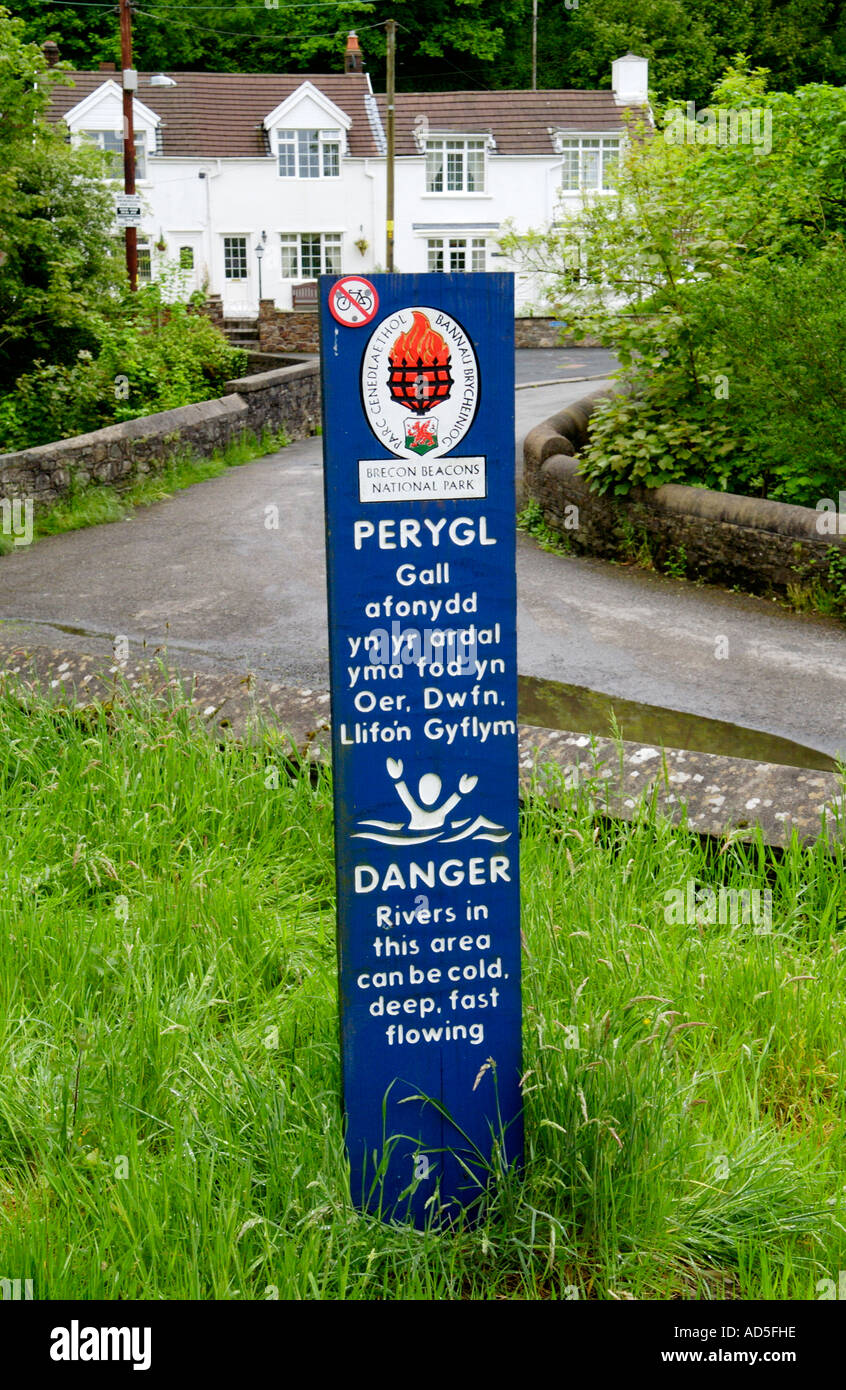 Bilingual Welsh English language danger sign on waterfall walk at ...