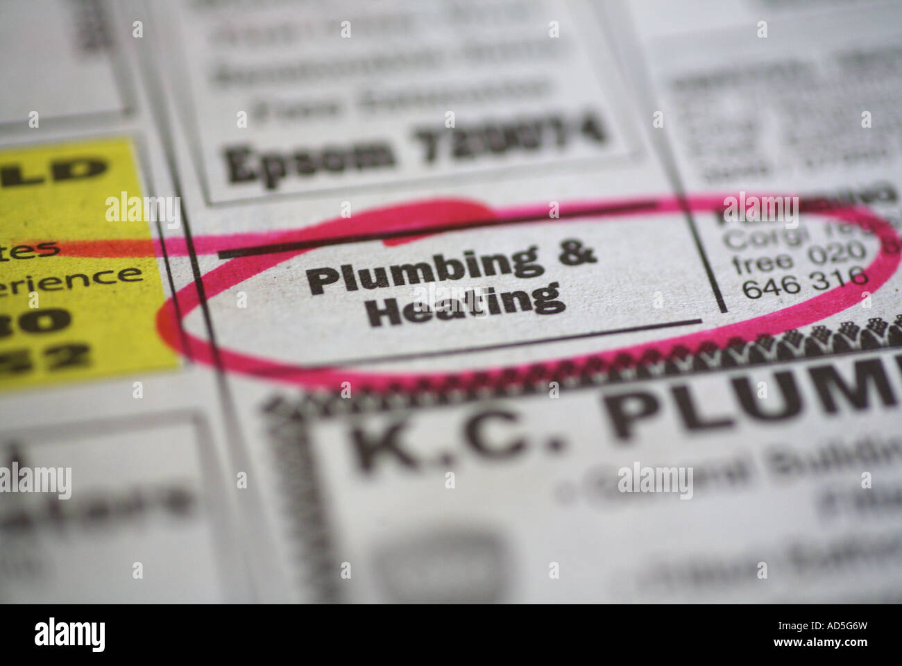 newspaper advert for plumbing and heating Stock Photo - Alamy