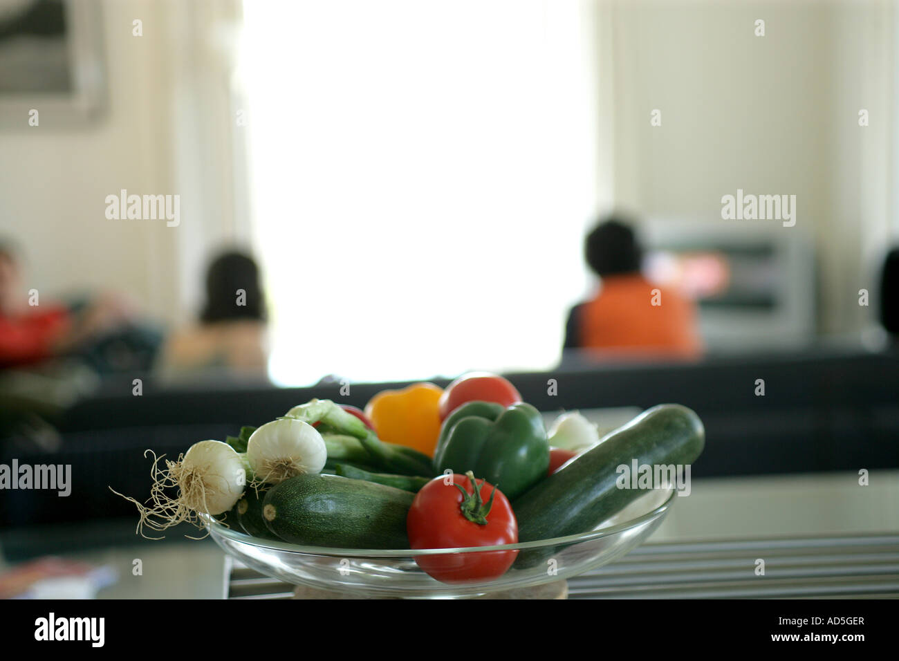 Vegetable plate set on a dining table Stock Photo - Alamy