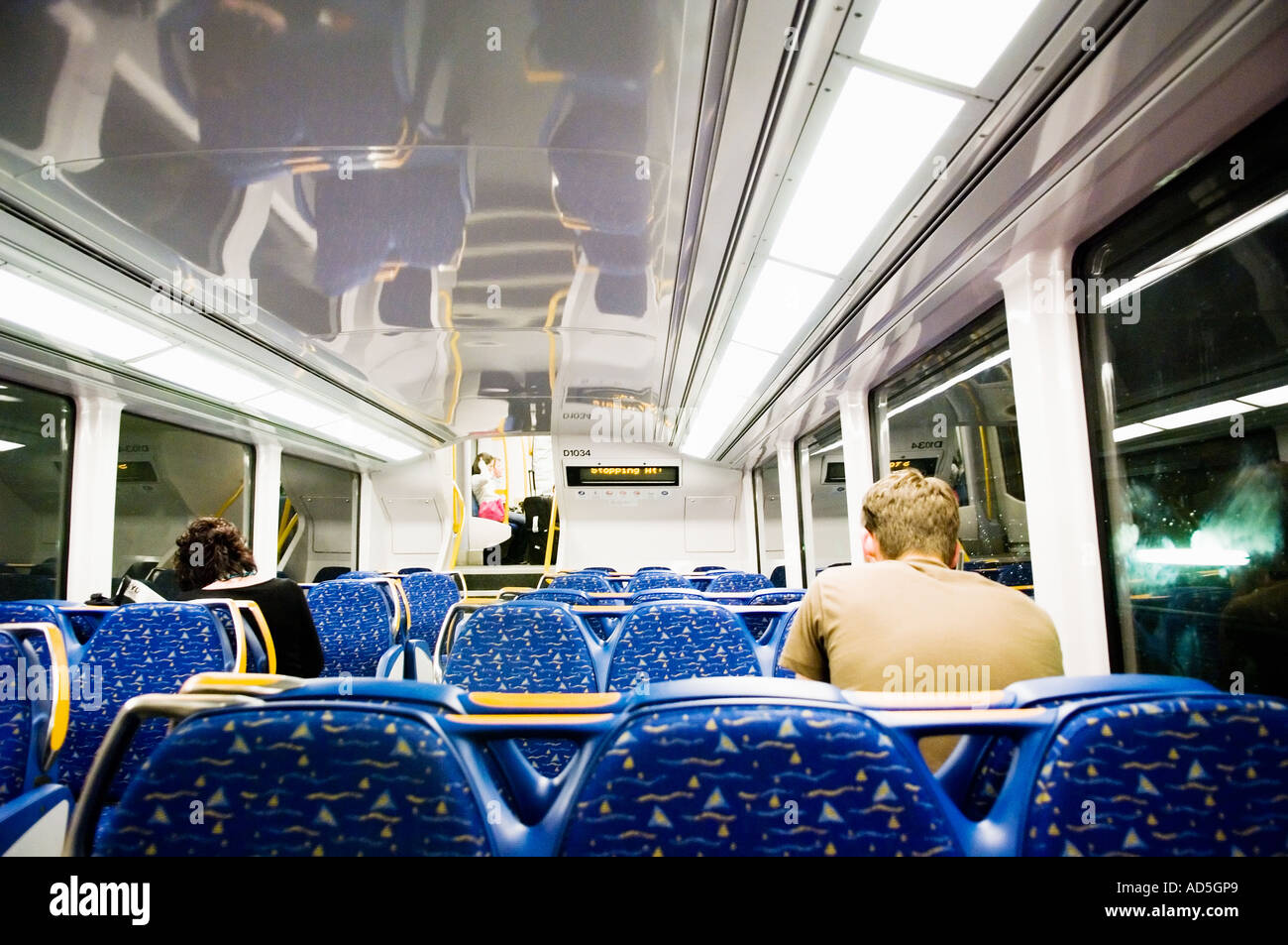 People siting in a train carriages, back to the camera Sydney Australia ...