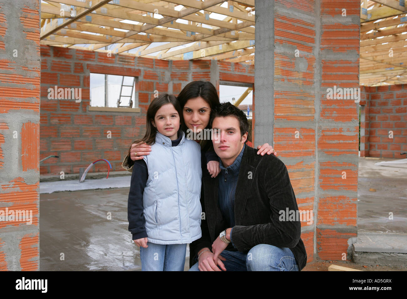 Family visiting house under construction Stock Photo - Alamy