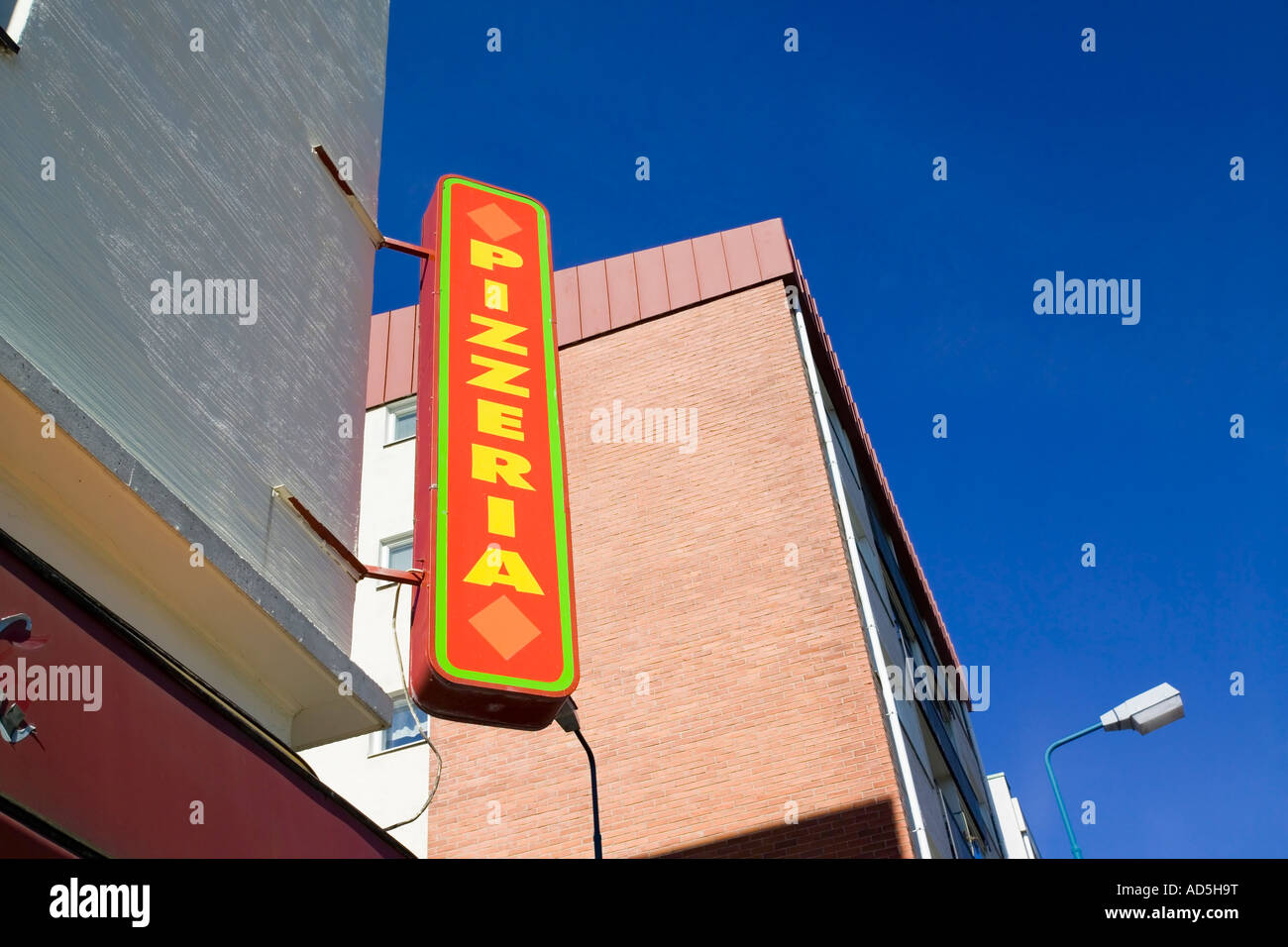 pizzeria sign on street corner Stock Photo - Alamy