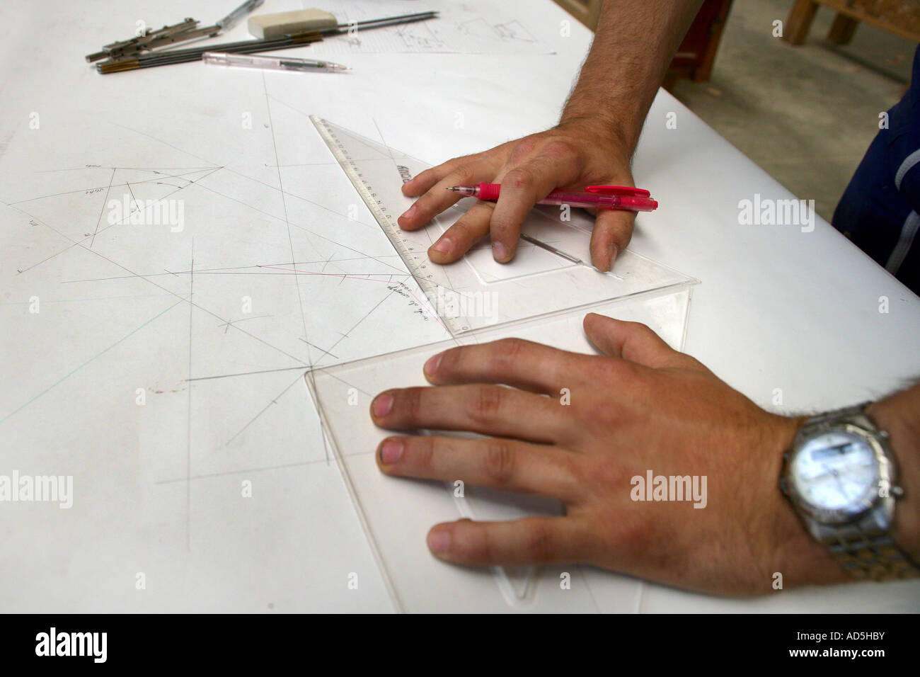 Architect drawing plan Stock Photo - Alamy