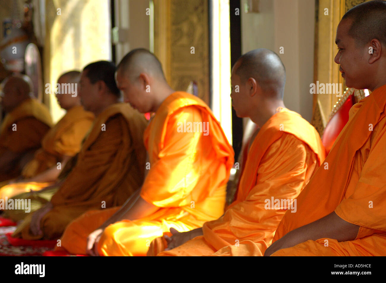 Buddhist monks holding prayers Stock Photo - Alamy
