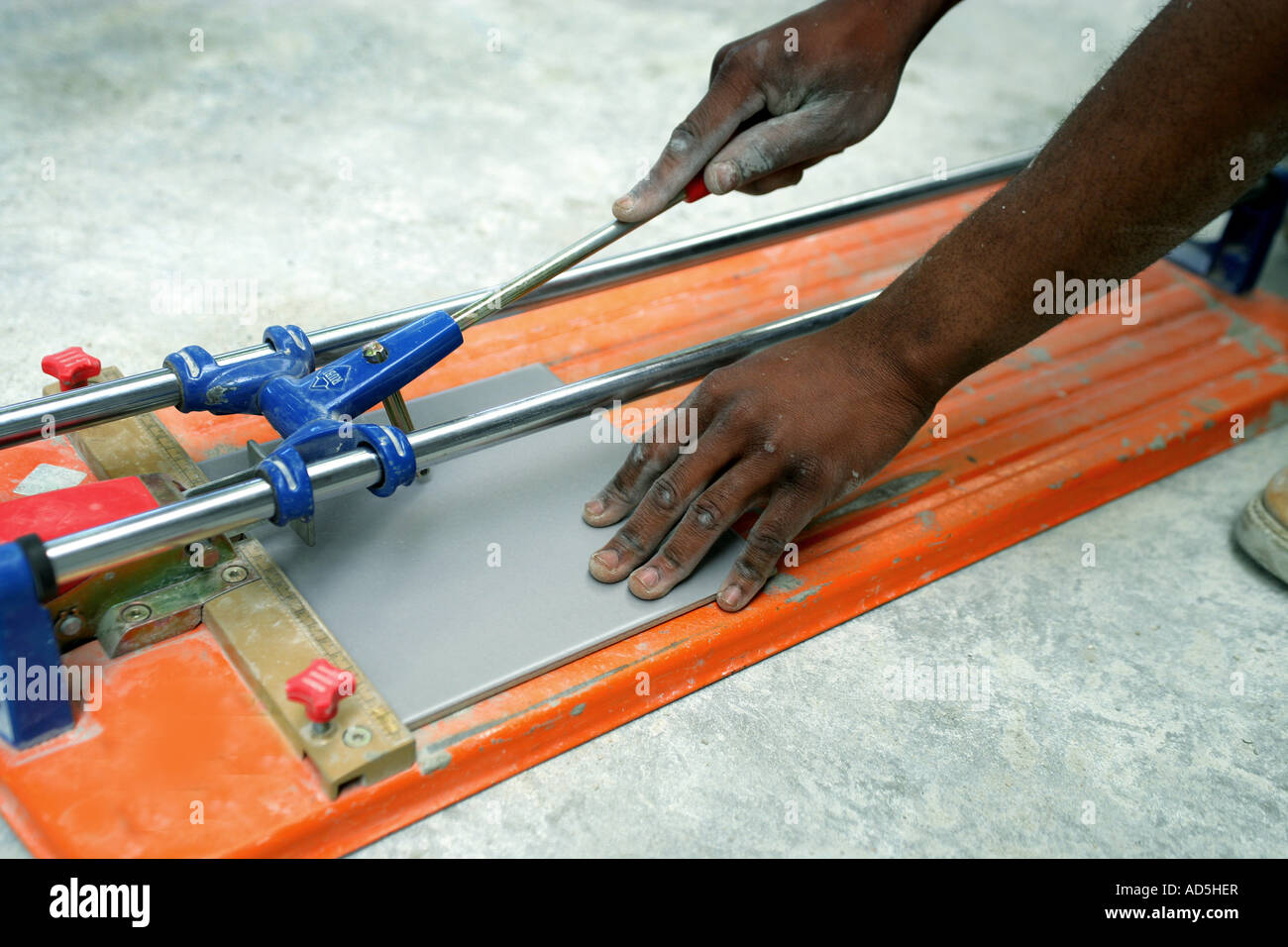 Tile cutting machine Stock Photo - Alamy