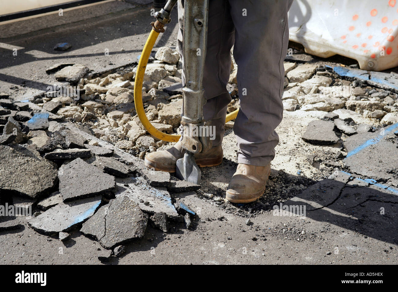 Worker breaking the pavement Stock Photo - Alamy