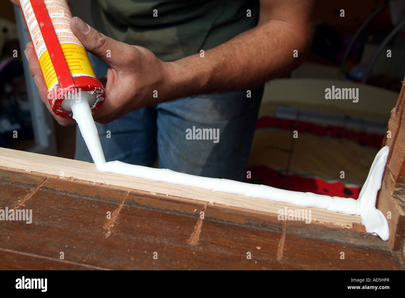 Joiner installing a window frame Stock Photo - Alamy