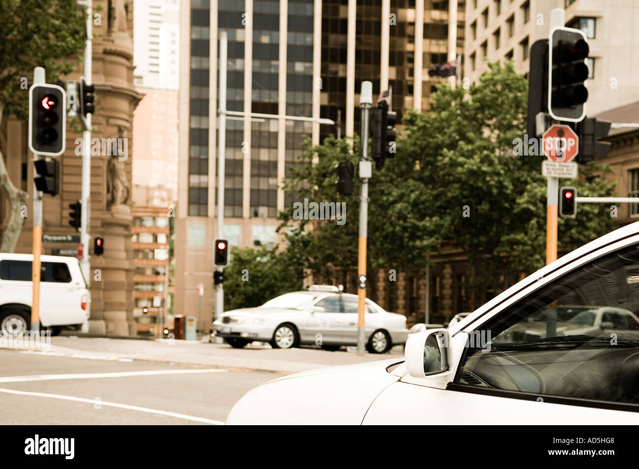 Urban city traffic at a street intersection Stock Photo - Alamy