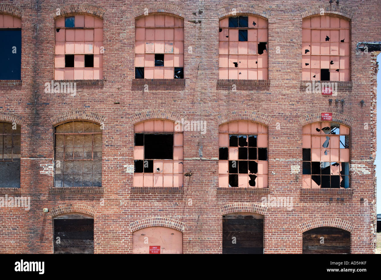 Old industrial brick warehouse building in run down condition, showing ...