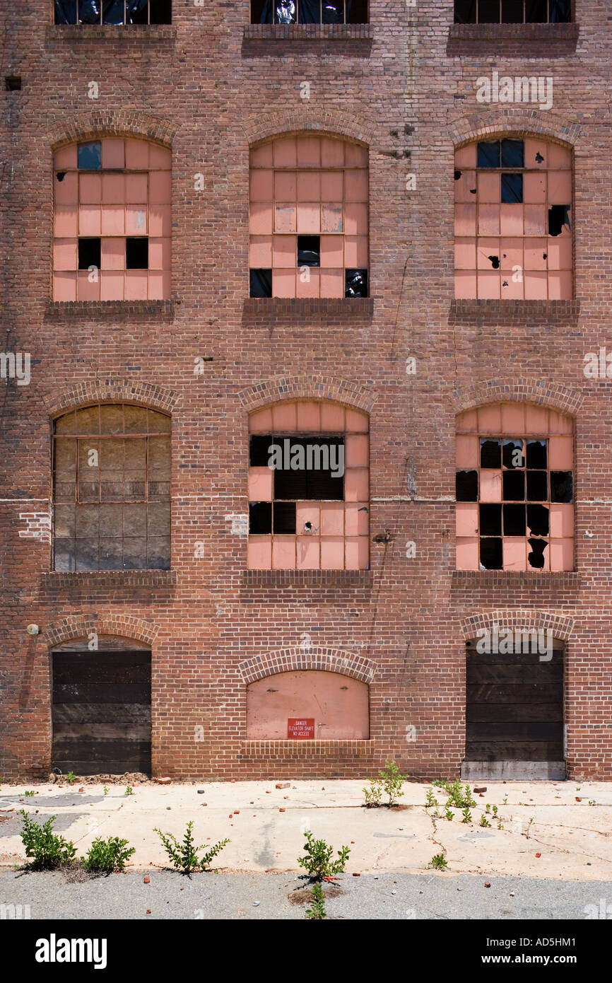 Old industrial brick warehouse building in run down condition, showing ...