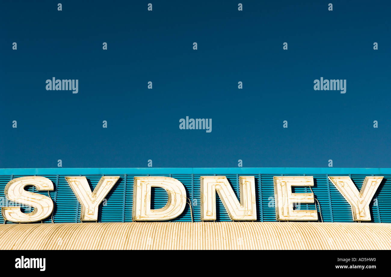 Large Sydney sign on top of building against a clear blue sky with copy ...
