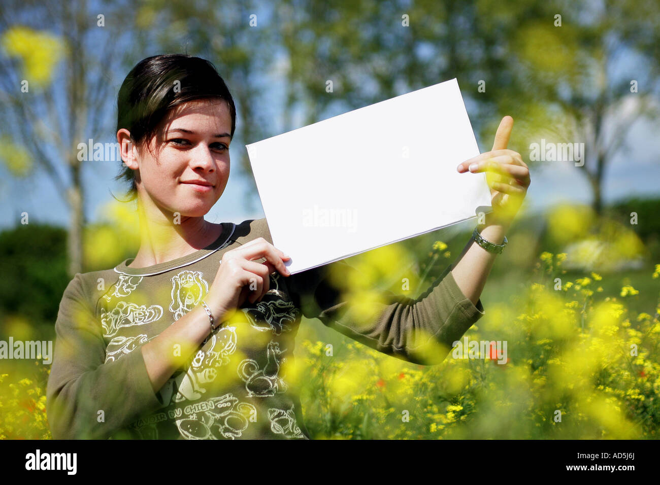 Girl showing a display board Stock Photo - Alamy