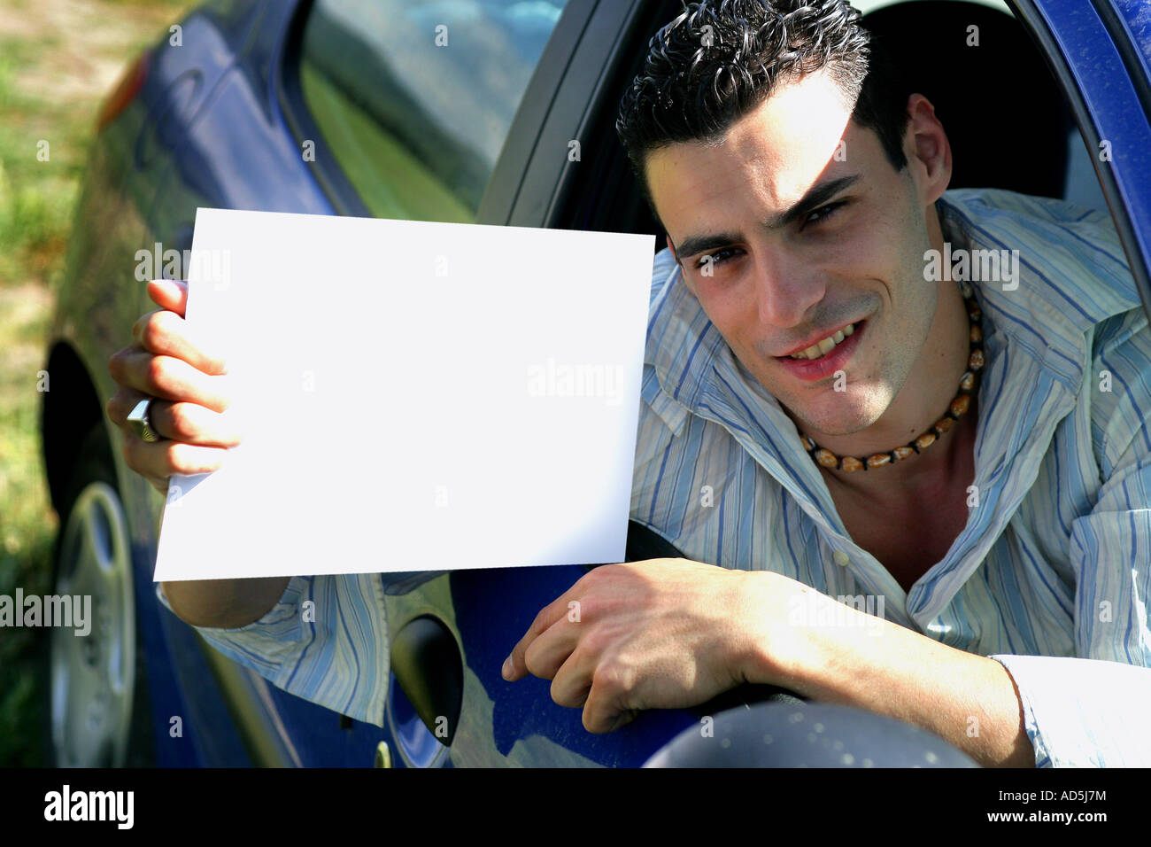 Man showing a white display board Stock Photo - Alamy