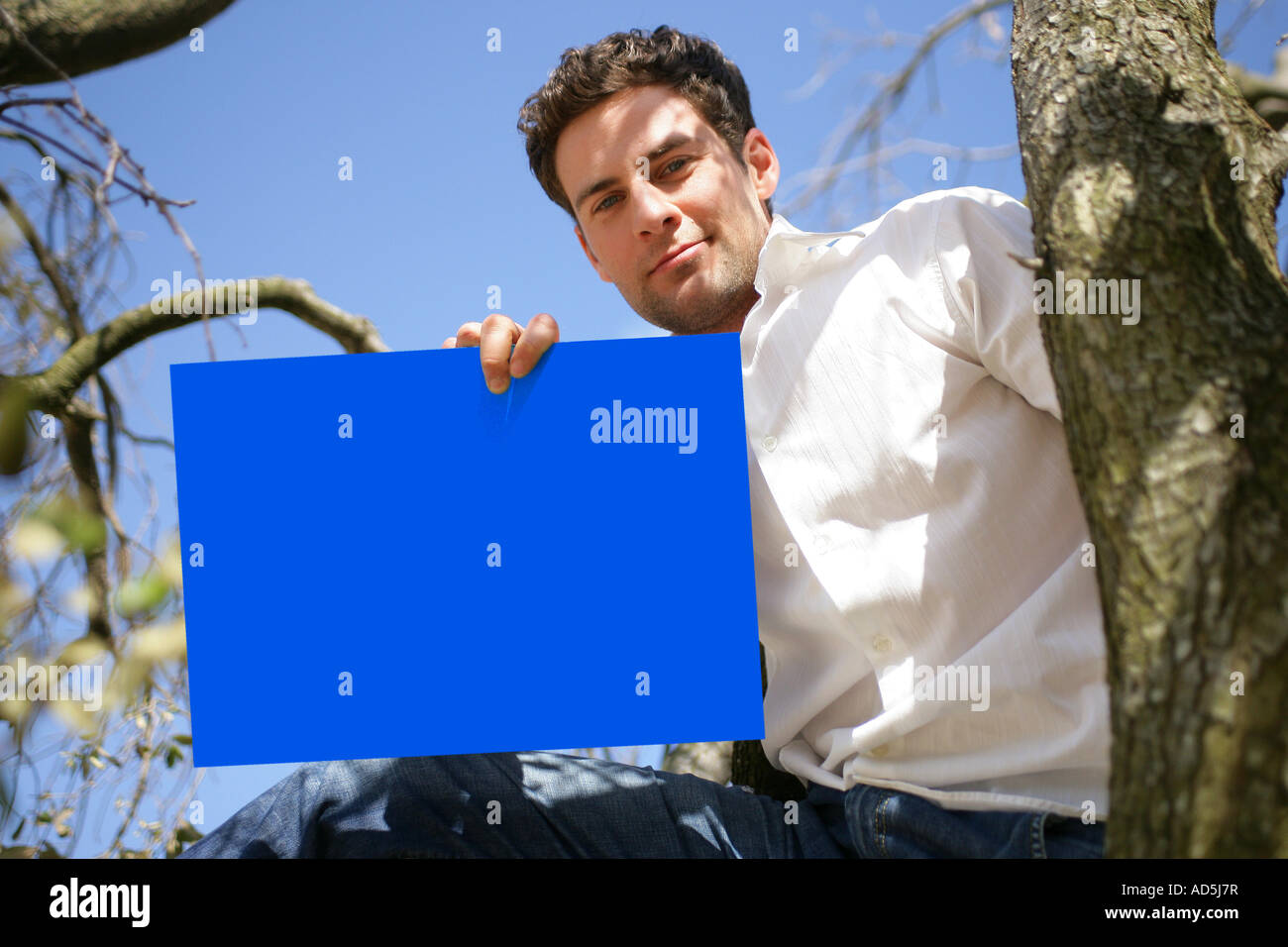 Man showing a blue display board Stock Photo - Alamy