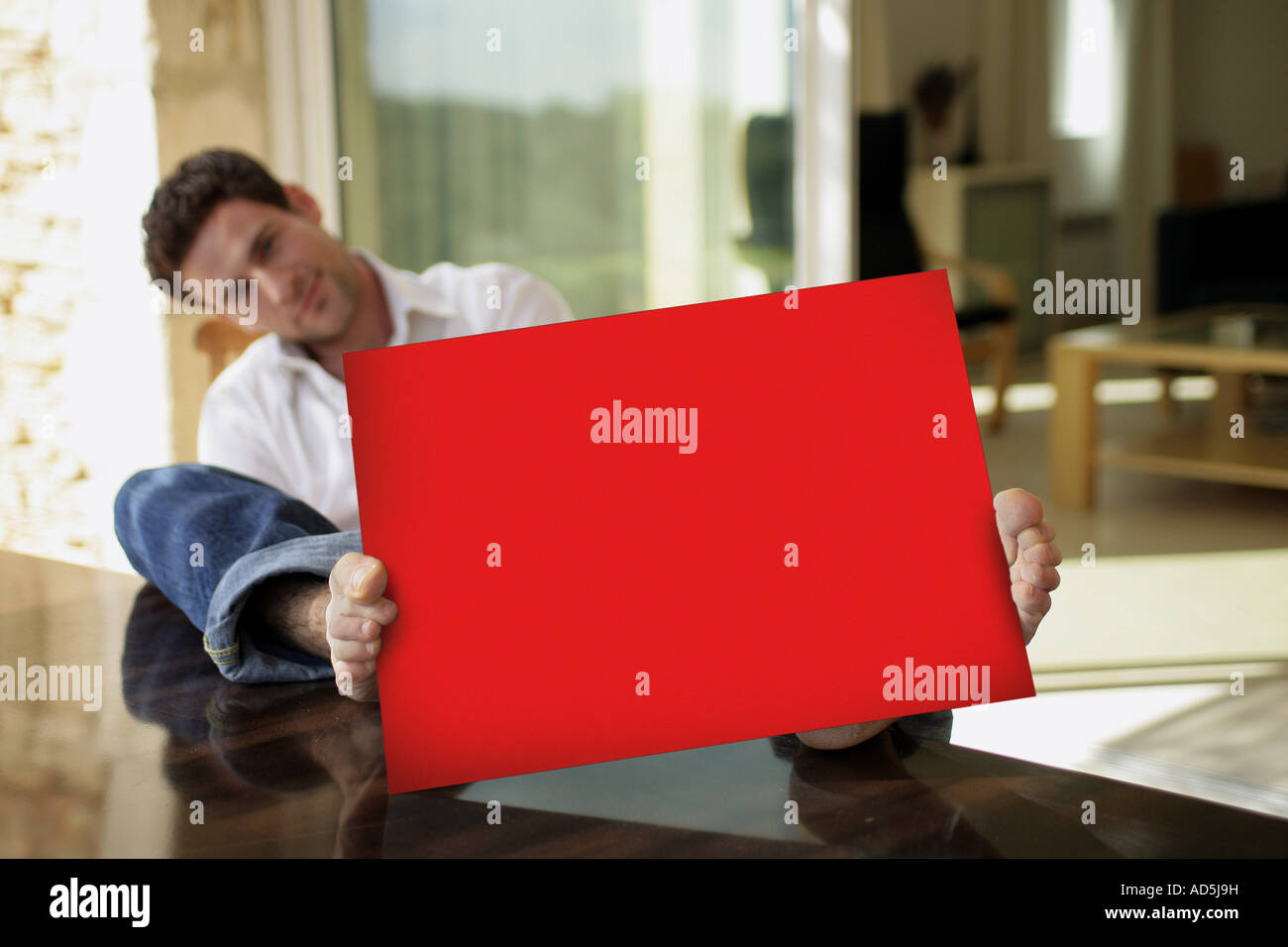 Man showing a red display board Stock Photo - Alamy