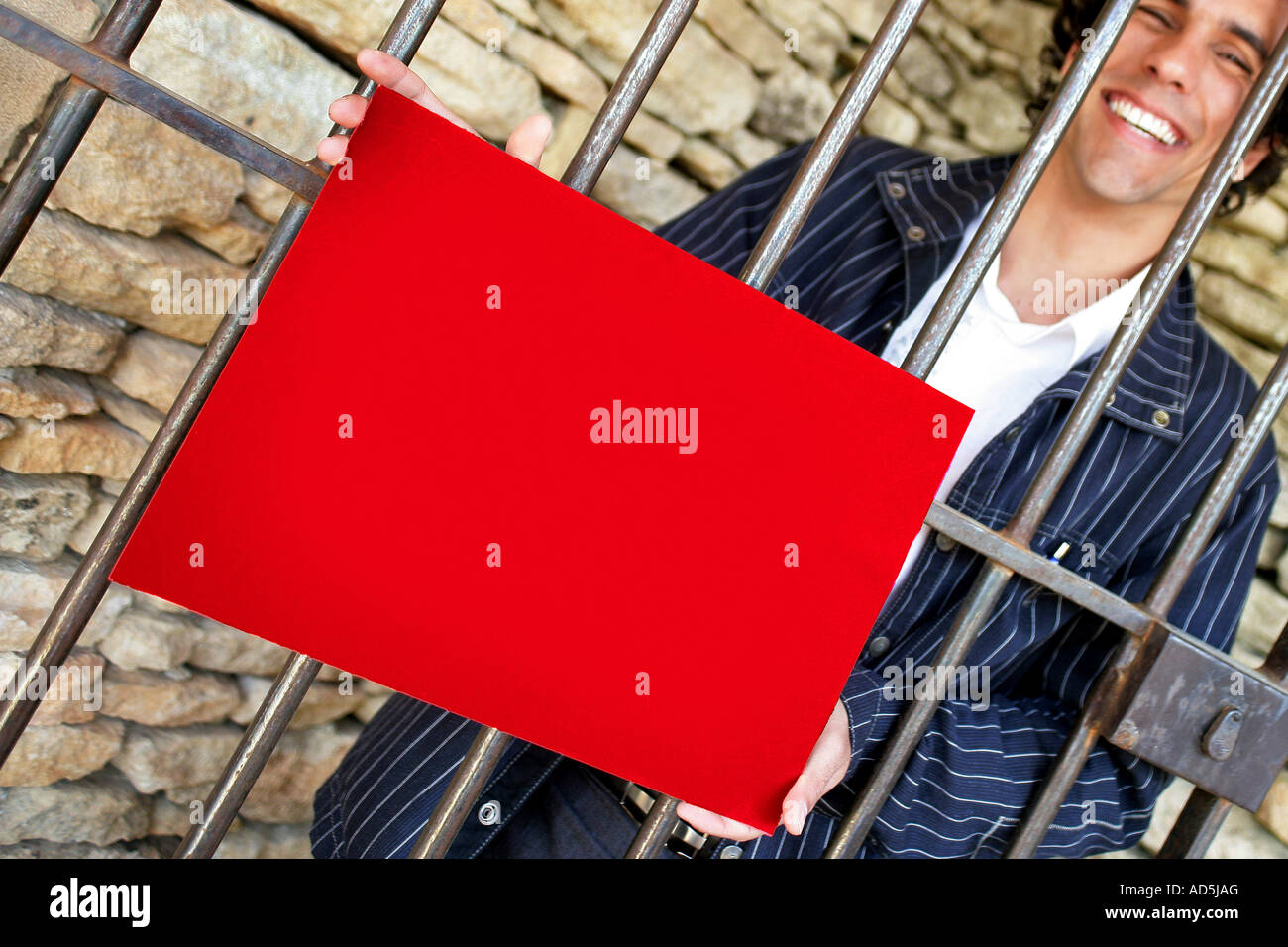 Man showing a red display board Stock Photo - Alamy