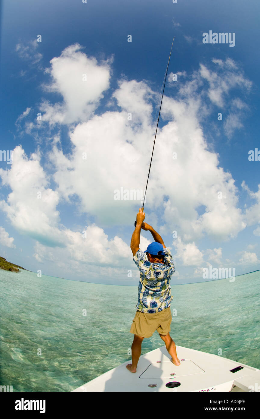 GREATER EXUMA BAHAMAS Fly fisherman fighting Bonefish from boat Stock ...