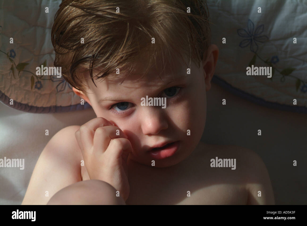 Child acting shy and unhappy Stock Photo - Alamy