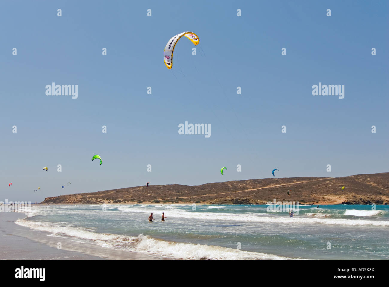 Horizontal wide angle of lots of people kitesurfing at Prasonisi, a ...