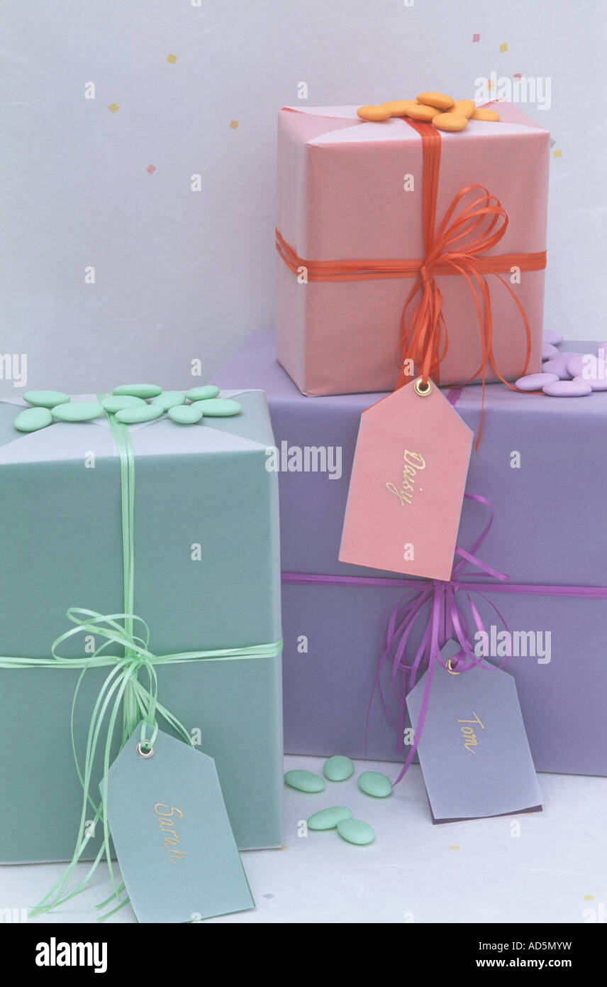 Presents wrapped in pastel paper and decorated with pastel string and ...