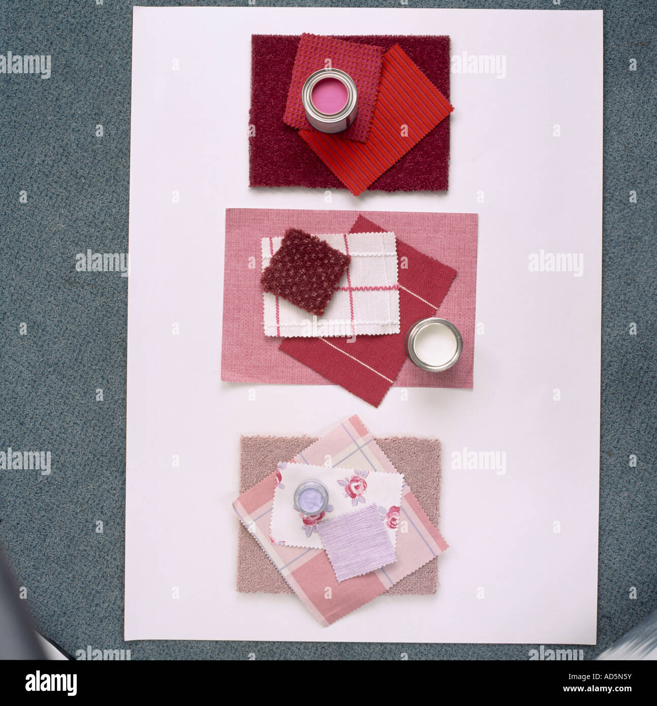 Patterned and plain fabric samples and paint on mood board Stock Photo ...