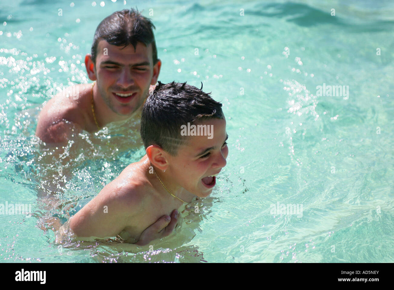Father and son swimming Stock Photo - Alamy