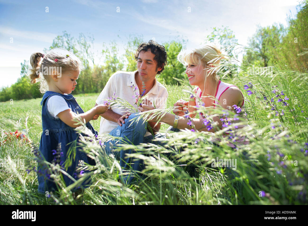 Young family in the countryside Stock Photo - Alamy