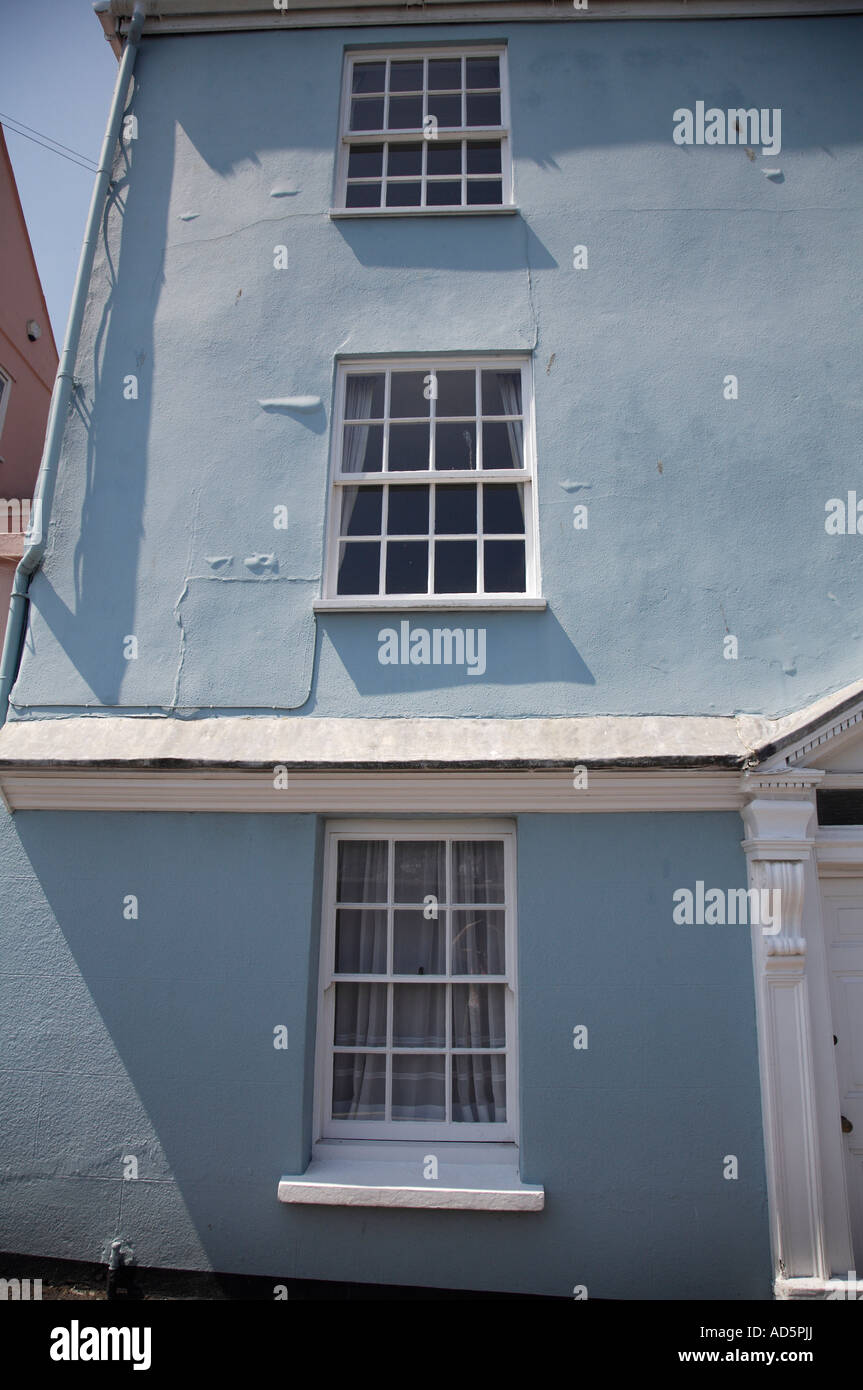 Pastel blue Georgian house with white window frames Stock Photo - Alamy