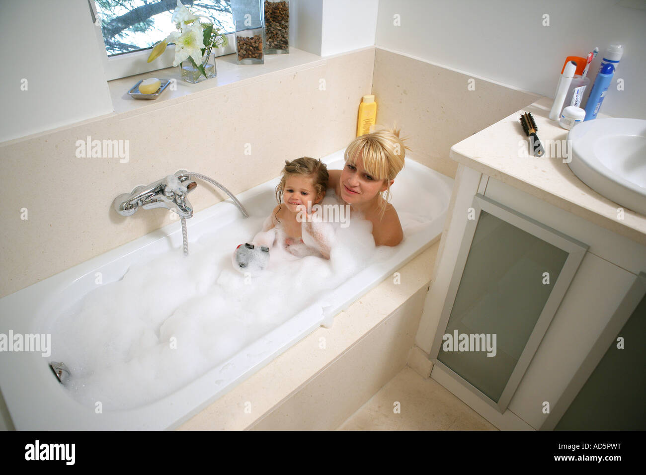 Mother and child taking a bath Stock Photo - Alamy