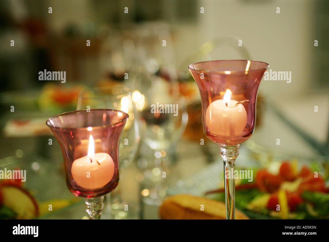 Candles in dining table Stock Photo - Alamy