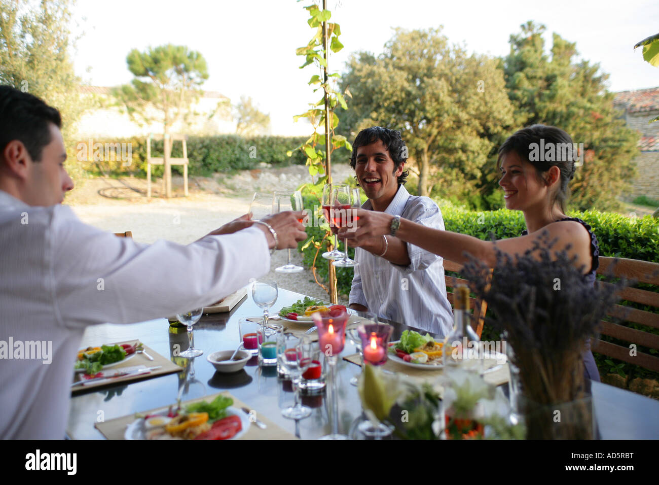 Friends having an outdoor meal Stock Photo - Alamy