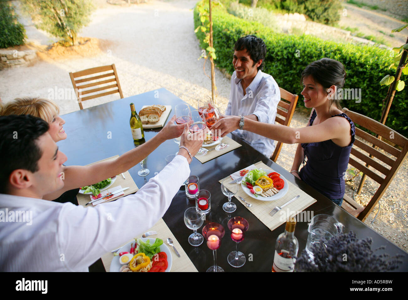 Friends having an outdoor meal Stock Photo - Alamy