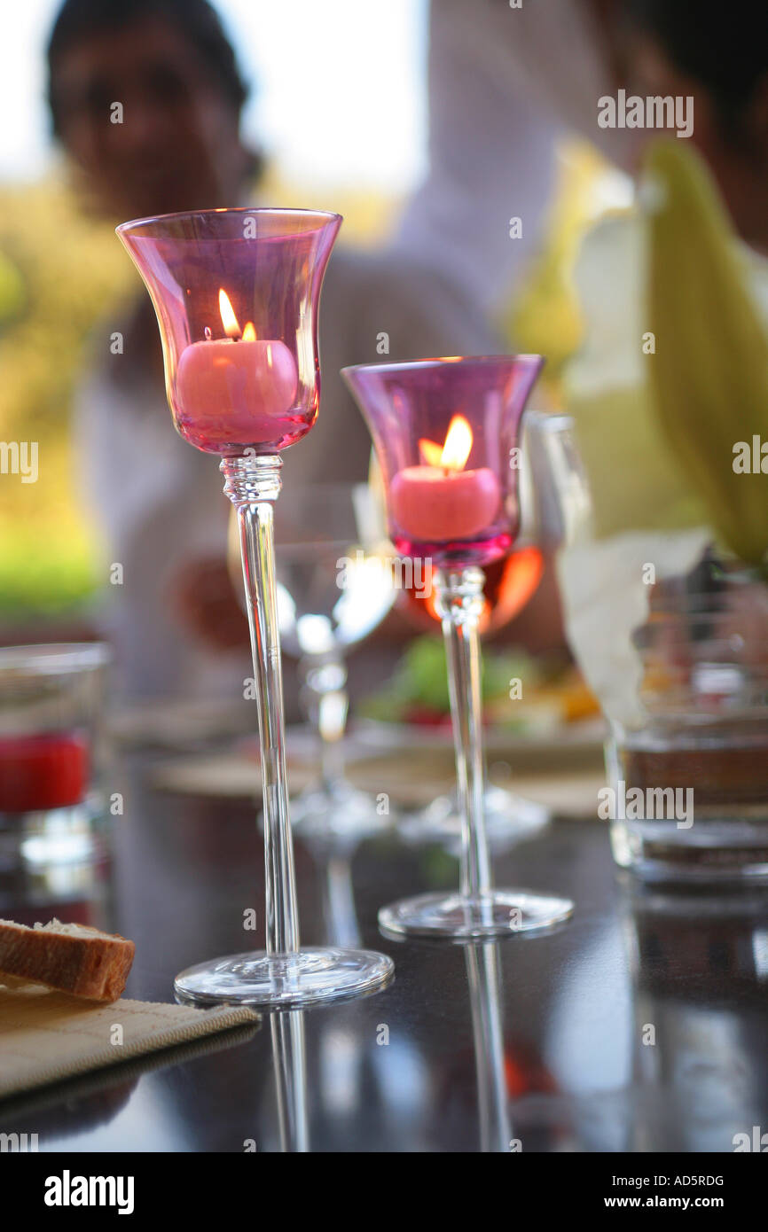 Candles on diner table Stock Photo - Alamy
