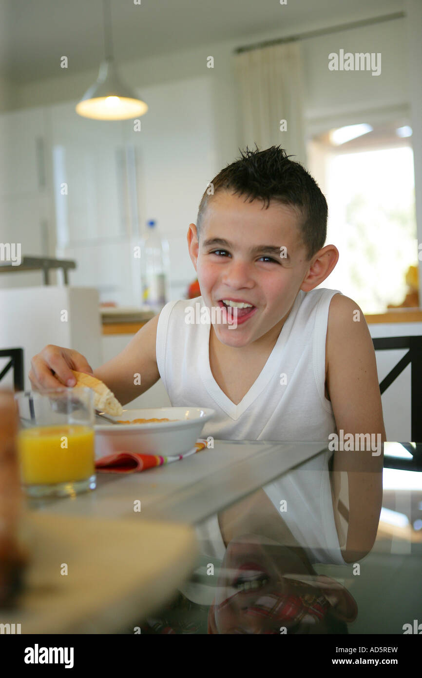 Little boy having breakfast Stock Photo - Alamy