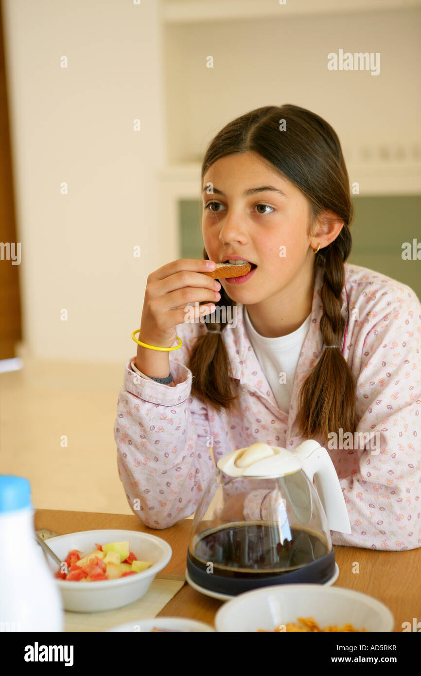 Girl having breakfast Stock Photo - Alamy