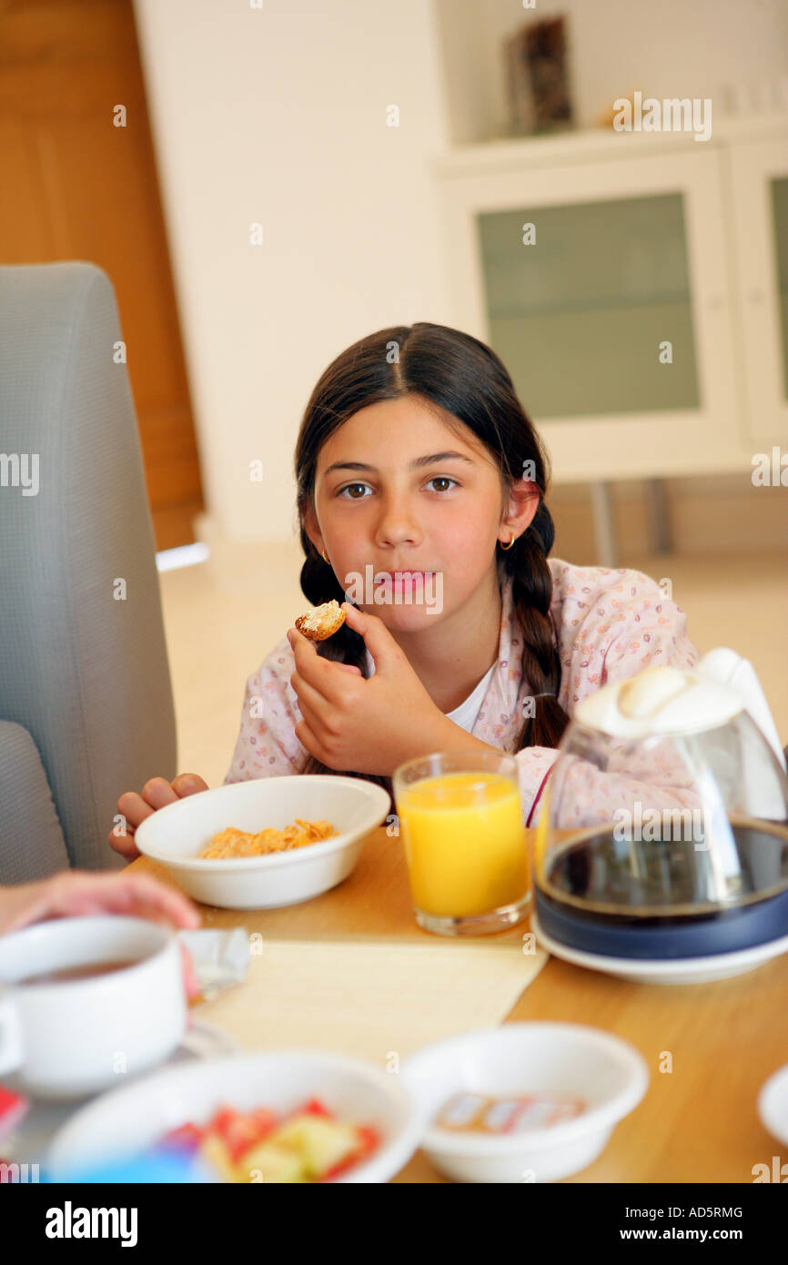 Girl having breakfast Stock Photo - Alamy