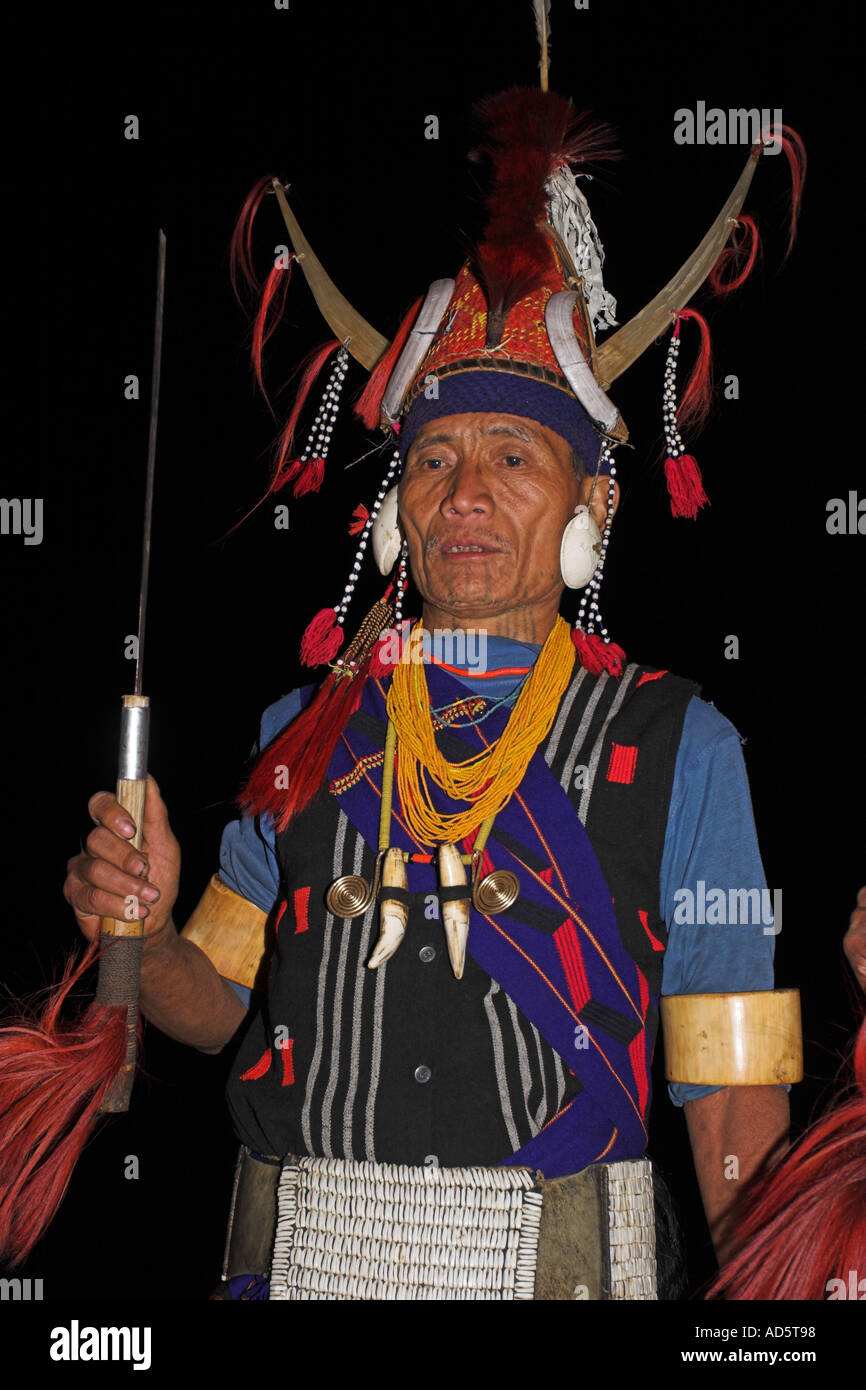 MYANMAR BURMA Naga man dancing wearing headdress with wild boar teeth ...