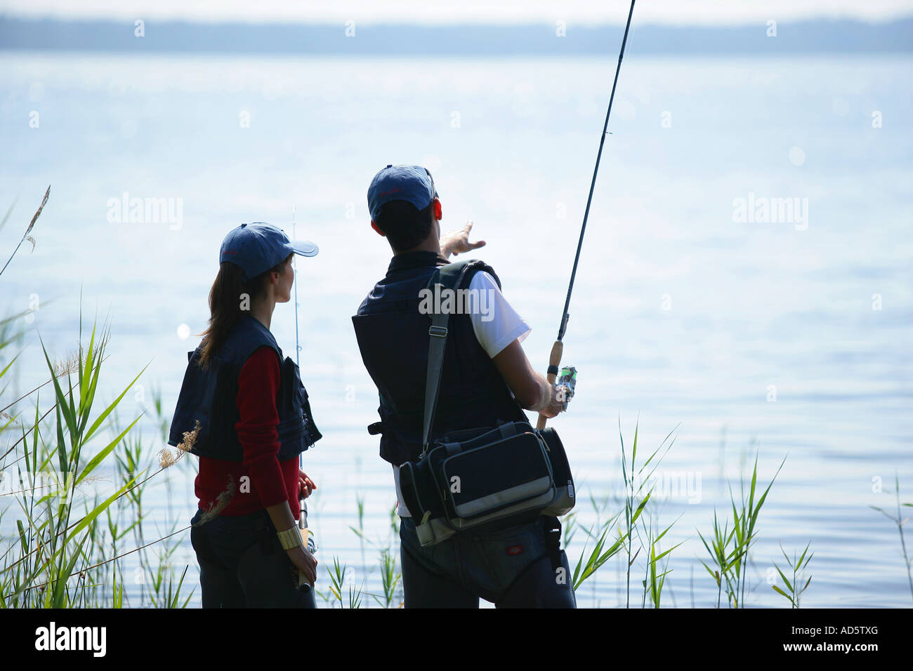 Young couple fishing Stock Photo - Alamy