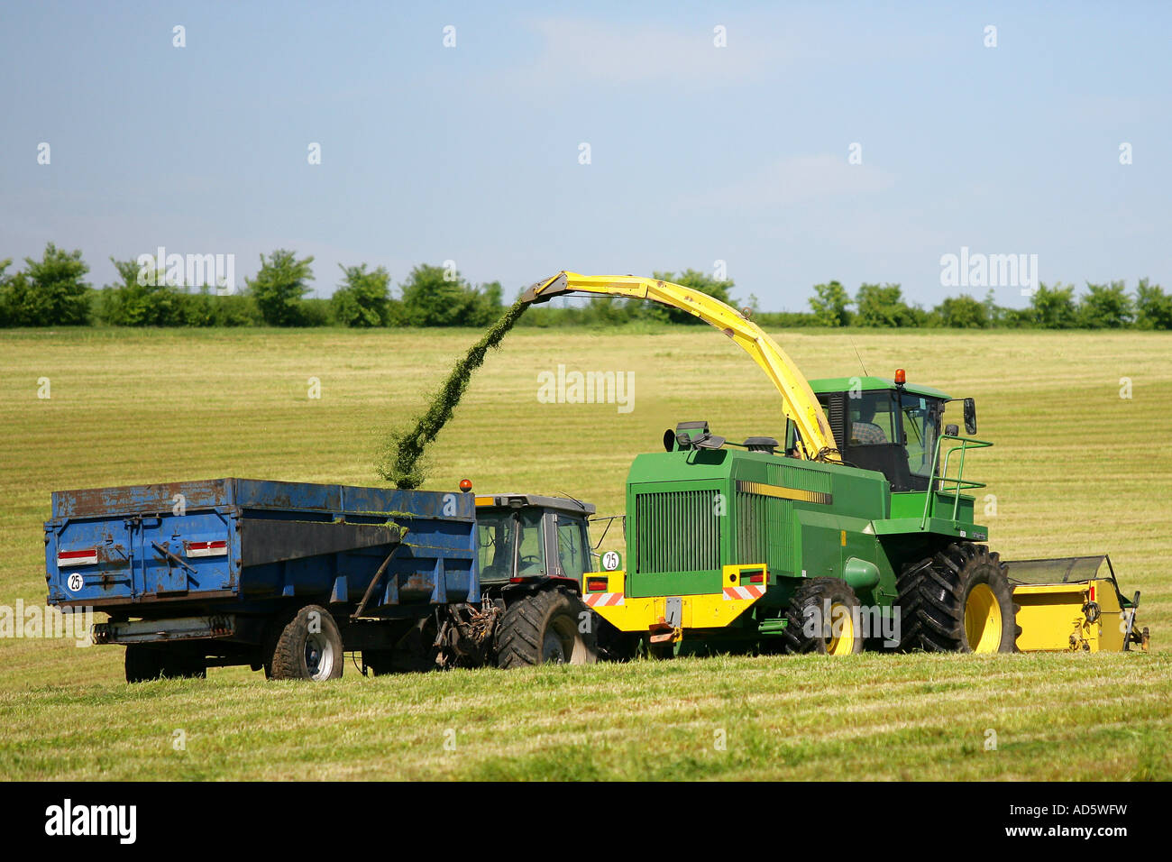Farm machines in a field Stock Photo - Alamy