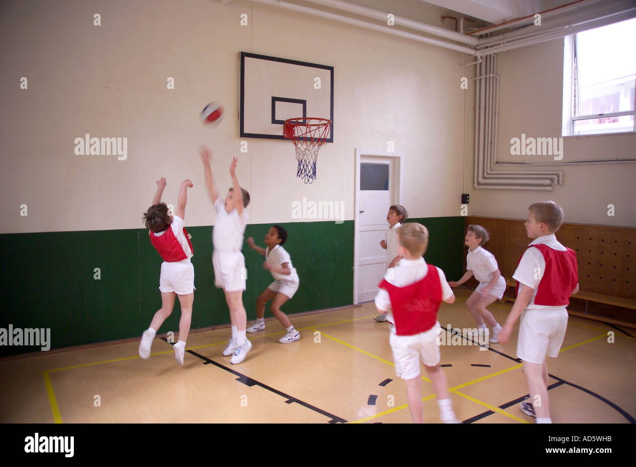 School kids playing basketball in school gym Stock Photo - Alamy