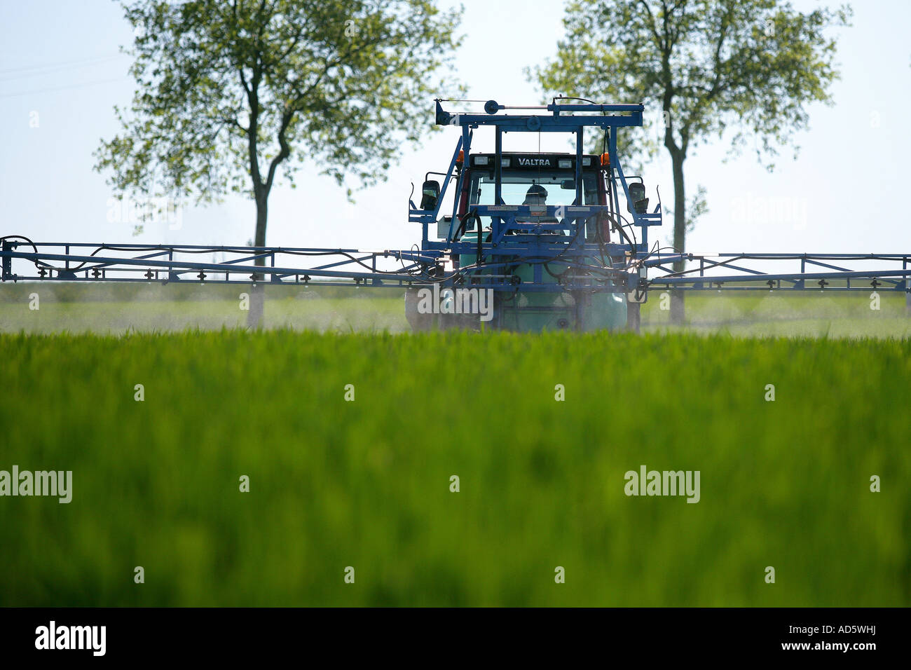 Farm machine in a field Stock Photo - Alamy