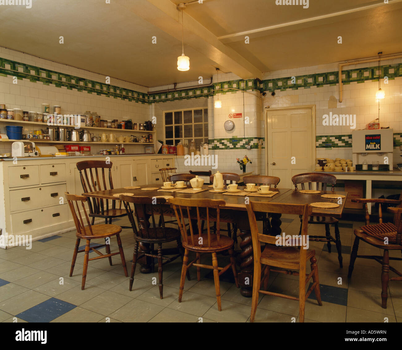 Large wooden table and chairs in old fashioned basement kitchen with ...