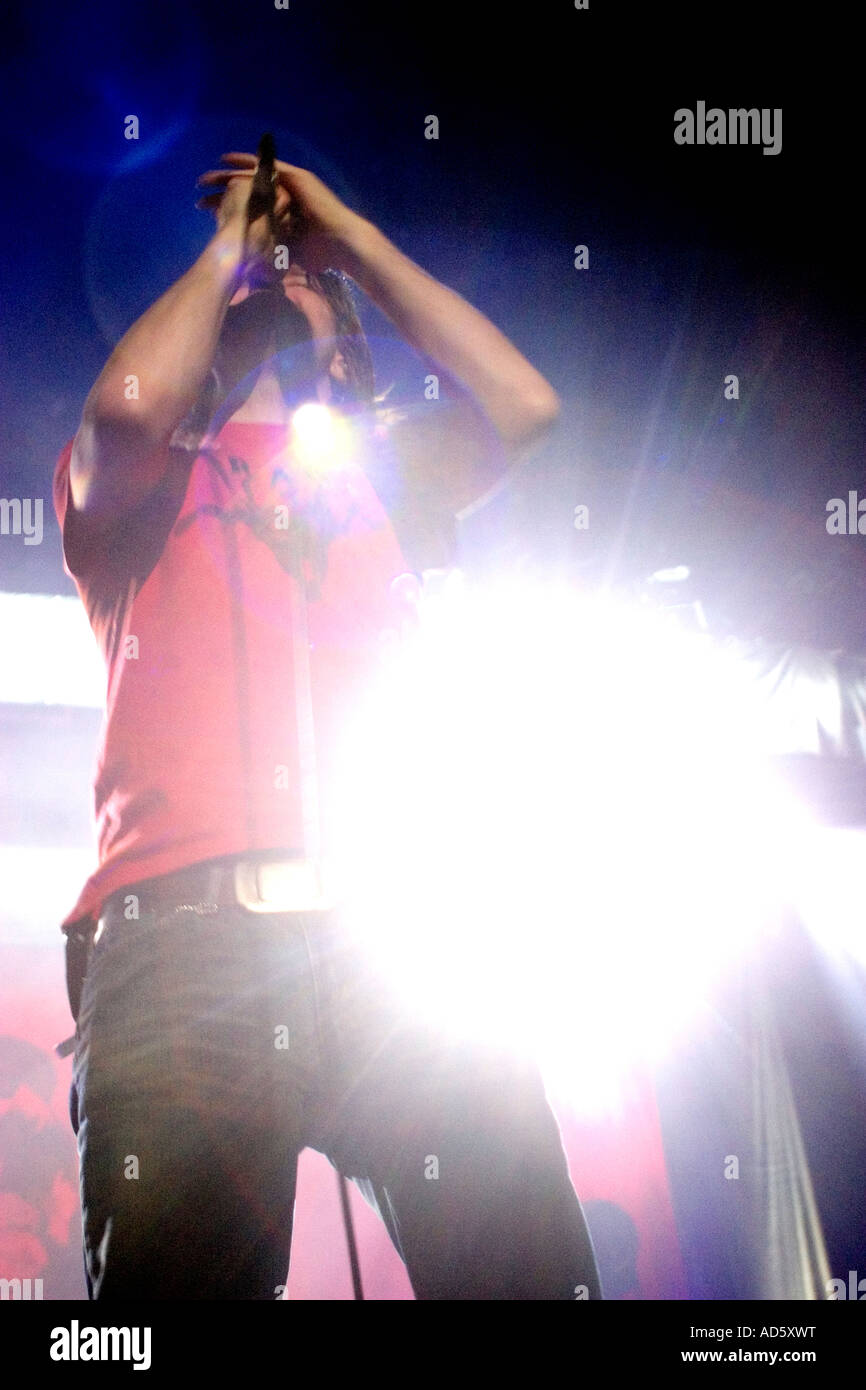 Singer on stage with spotlight at The Apollo Manchester Stock Photo - Alamy