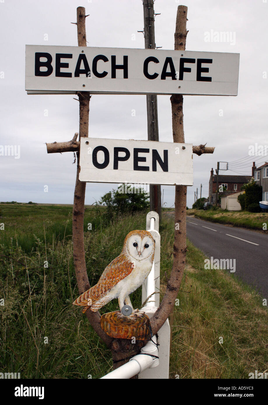 Owl sign for the Beach cafe Stock Photo - Alamy
