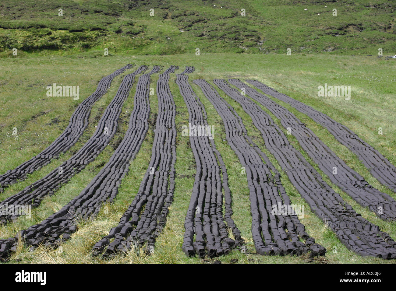 Peat turf bog lands machine cut turf Ireland Stock Photo - Alamy
