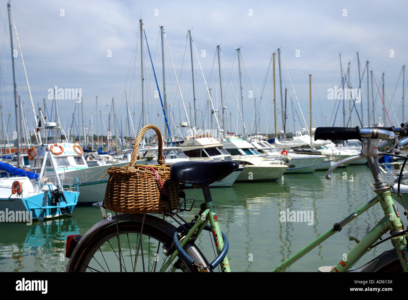 Bicycle with basket with port background Stock Photo - Alamy