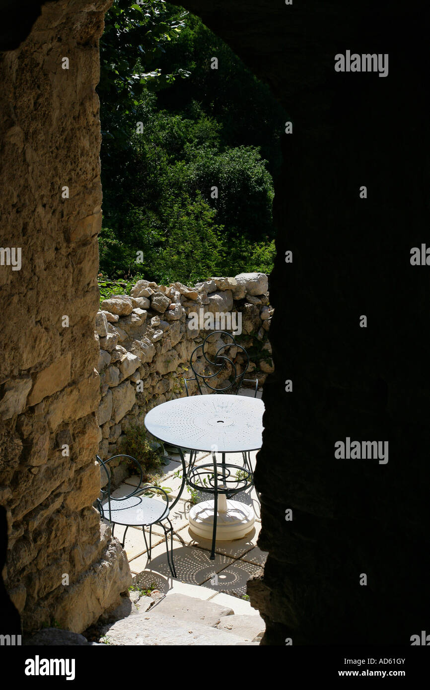 Table and chairs on a terrace Stock Photo - Alamy